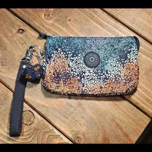 Kipling | Bags | Kipling Multicolor Clutch With Wrist Strap And ...